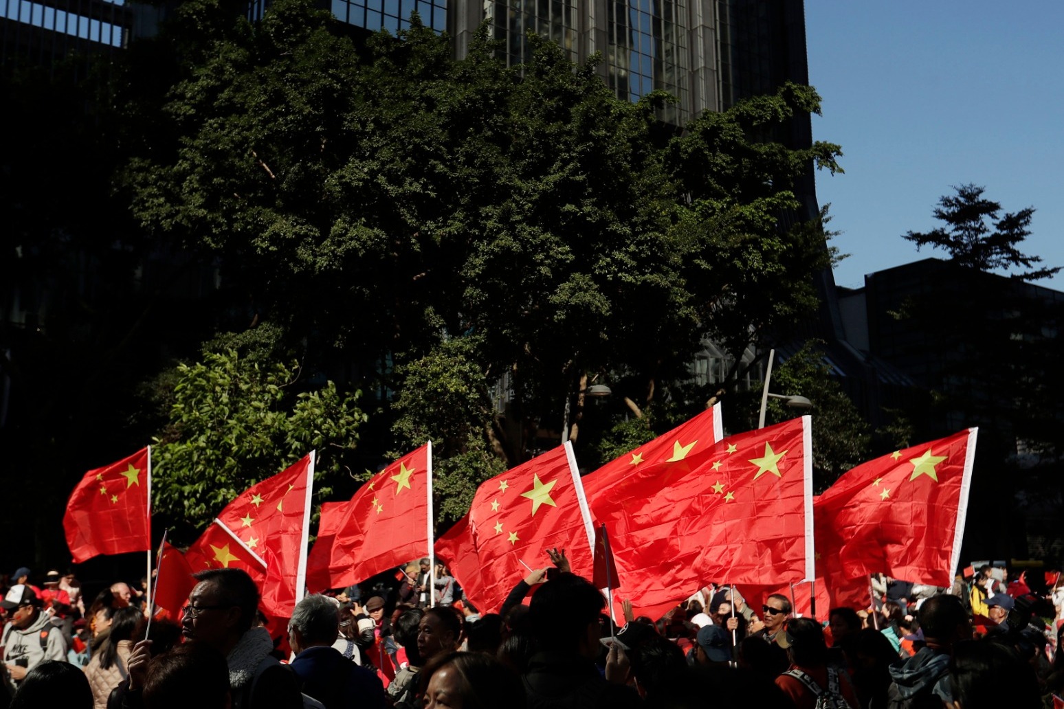 PRO-GOVERNMENT PROTESTERS DENOUNCE HONG KONG \'RIOTERS\' | Radio NewsHub